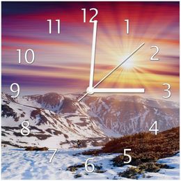 Wallario Wanduhr Farbenfroher Sonnenuntergang im Winter - Schnee in den Bergen (Aluverbunduhr), rot, mit weißen Zeigern