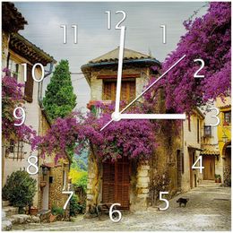 Wallario Wanduhr Malerische Stadt in der Provence mit bunten Blumen (Aluverbunduhr), gelb, mit weißen Zeigern