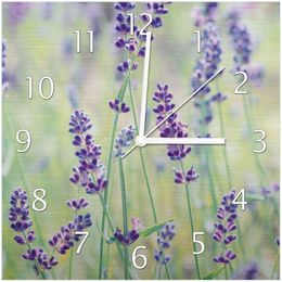Wallario Wanduhr Lila Blumenfreude - Violette Pflanzen auf der Wiese (Aluverbunduhr), grün, mit weißen Zeigern