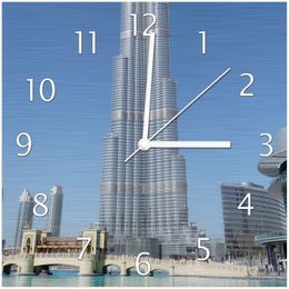 Wallario Wanduhr Wolkenkratzer in Dubai (Aluverbunduhr), blau, mit weißen Zeigern