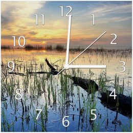 Wallario Wanduhr Schilf am Abend - Sonnenuntergang über der Seelandschaft (Aluverbunduhr), blau, mit weißen Zeigern