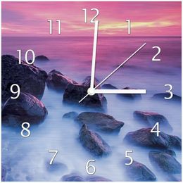Wallario Wanduhr Felsen im Meer bei Sonnenuntergang (Aluverbunduhr), blau, mit weißen Zeigern