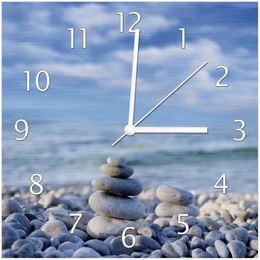 Wallario Wanduhr Steinstapel am Strand (Aluverbunduhr), blau, mit weißen Zeigern