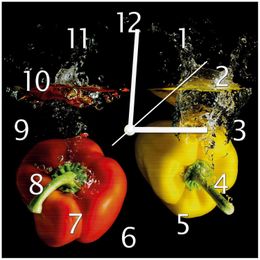 Wallario Wanduhr Bunte Küche Paprika in rot gelb orange und grün im Wasser (Aluverbunduhr), mit weißen Zeigern