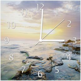 Wallario Wanduhr Sonnenuntergang über dem Meer (Aluverbunduhr), blau, mit weißen Zeigern