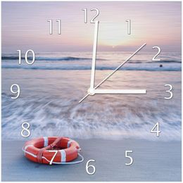 Wallario Wanduhr Rettungsring am Strand bei Sonnenuntergang (Aluverbunduhr), blau, mit weißen Zeigern