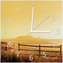 Wallario Wanduhr Strand in Südafrika I - Himmel in orange (Aluverbunduhr), gelb, mit weißen Zeigern