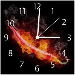 Wallario Wanduhr Heiße, brennende Chili-Schote vor schwarzem Hintergrund (Aluverbunduhr), mit weißen Zeigern