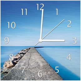 Wallario Wanduhr Pier am blauen Ozean mit blauem Himmel (Aluverbunduhr), mit weißen Zeigern