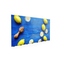 Primedeco Garderobenpaneel Magnetwand und Memoboard aus Glas Zitronen auf Holztisch
