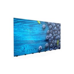 Primedeco Garderobenpaneel Magnetwand und Memoboard aus Glas Heidelbeeren auf Hintergrund