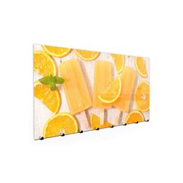 Primedeco Garderobenpaneel Magnetwand und Memoboard aus Glas Orangeneis am Stiel