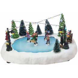 Spetebo - led Weihnachts Dorf Szene Eisbahn - 32 x 24 cm - Beleuchtete Tisch Dekoration mit fahrenden Figuren