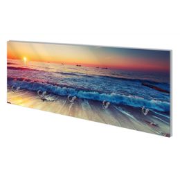 Wallario Wandgarderobe Sonnenuntergang am Meer mit Wellen am Strand (1-teilig