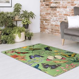Teppich Schmetterlinge mit Blumen auf Grün