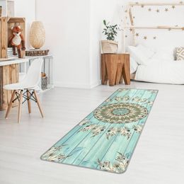 Teppich Mandala Aquarell Federn blau grün auf Planke