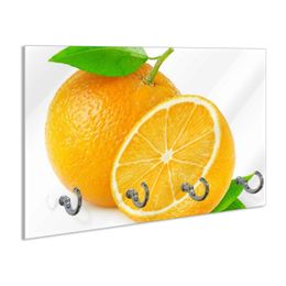 Wallario Schlüsselbrett Saftige Orangen vor weißem Hintergrund