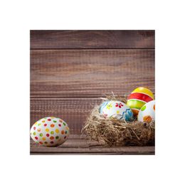 Wallario Acrylglasbild, Bunte bemalte Eier an Ostern im Vorgelnest vor hölzerner Wand