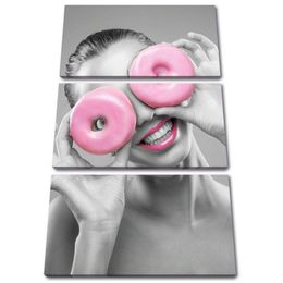 Pixxprint Leinwandbild lustige Frau mit rosa Donut Augen