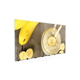 Primedeco Garderobenpaneel Magnetwand und Memoboard aus Glas Banane und Haferflocken