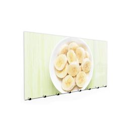 Primedeco Garderobenpaneel Magnetwand und Memoboard aus Glas Bananen auf Teller