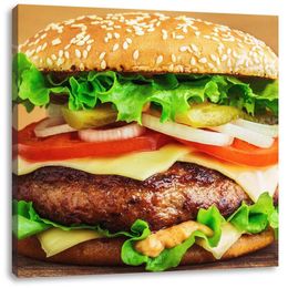 Pixxprint Leinwandbild Köstlicher Burger auf Holztisch