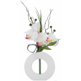 Künstliche Orchidee in einer nicht-traditionellen Vase, spektakuläre Ornament in Form von bunten Blumen - Atmosphera