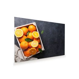 Primedeco Glasbild Wandbild Orangen im Korb mit Aufhängung