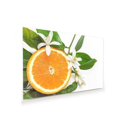 Primedeco Glasbild Wandbild Orangenschnitz auf Blätter mit Aufhängung