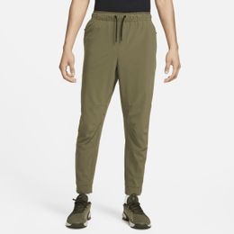 Nike Unlimited vielseitige Dri-FIT Hose mit Reißverschluss am Bündchen für Herren - Grün