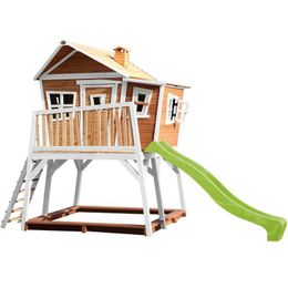 AXI Spielhaus Max mit Sandkasten & hellgrüner Rutsche Stelzenhaus in Braun & Weiß aus fsc Holz für Kinder Spielturm mit Wellenrutsche für den Garten