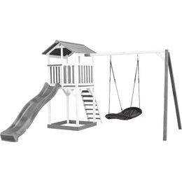 AXI Beach Tower Spielturm aus Holz in Weiß & Grau Spielhaus für Kinder mit grauer Rutsche, Roxy Nestschaukel und Sandkasten Stelzenhaus für den Garten