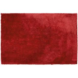 Beliani Teppich Rot Stoff rechteckig 140 x 200 cm einfarbig getuftet Modern Industrie Stil Langhaar Shaggy Flur Wohn-, Kinder- und Schlafzimmer - Rot
