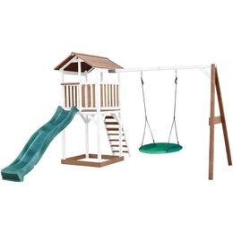 AXI Beach Tower Spielturm aus Holz in Braun & Weiß Spielhaus für Kinder mit grüner Rutsche, Summer Summer Nestschaukel und Sandkasten Stelzenhaus für den