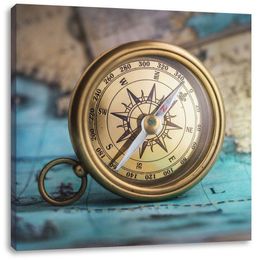 Pixxprint Leinwandbild Alter Kompass auf Weltkarte