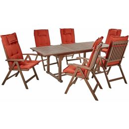 Beliani Gartenmöbel Set Dunkelbraun und Rot Akazienholz 7-Teilig Ausziehtisch mit 6 Stühlen 6 Auflagen Klappbar Verstellbar Modern Terrasse Ausstattung