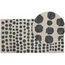 Beliani - Teppich Beige u. Schwarz Wolle Rechteckig 80 x 150 cm mit Punkte Muster Boho Skandinavisch für Wohn- und Schlafzimmer - Schwarz