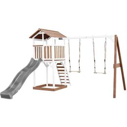 AXI Beach Tower Spielturm aus Holz in Braun & Weiß Spielhaus für Kinder mit grauer Rutsche, Doppelschaukel und Sandkasten Stelzenhaus für den Garten