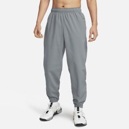 Nike Form vielseitige Hose mit schmal zulaufender Passform und für Herren - Grau