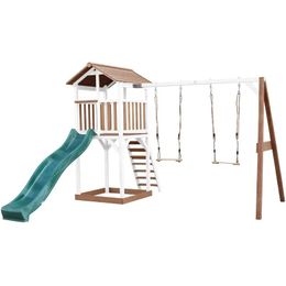 AXI - Beach Tower Spielturm aus Holz in Braun & Weiß Spielhaus für Kinder mit grüner Rutsche, Doppelschaukel und Sandkasten Stelzenhaus für den