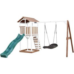 AXI Beach Tower Spielturm aus Holz in Braun & Weiß Spielhaus für Kinder mit grüner Rutsche, RoxyRoxy Nestschaukel und Sandkasten Stelzenhaus für den