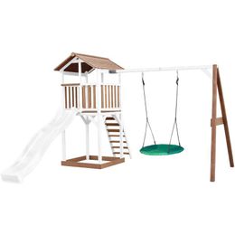 AXI Beach Tower Spielturm aus Holz in Braun & Weiß Spielhaus für Kinder mit weißer Rutsche, Summer Summer Nestschaukel und Sandkasten Stelzenhaus für den