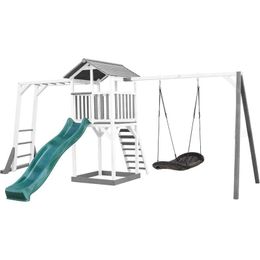 AXI Beach Tower Spielturm aus Holz in Weiß & Grau Spielhaus für Kinder mit grüner Rutsche, Klettergerüst, Roxy Nestschaukel und Sandkasten Stelzenhaus