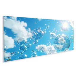 islandburner Leinwandbild Schwebende blaue Blasen gleiten elegant durch den himmelblauen Hinterg