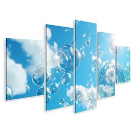 islandburner Leinwandbild Schwebende blaue Blasen gleiten elegant durch den himmelblauen Hinterg