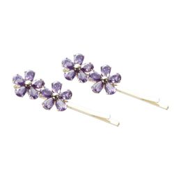 Kosmetex Haargummi 2 St. Blütenförmige Haarschieber-Set mit violett Zirkonen