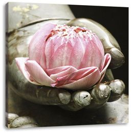 Pixxprint Leinwandbild Lotus auf der Hand eines Buddhas