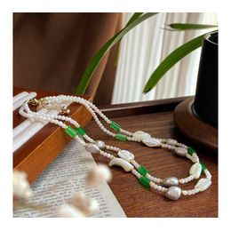 DTC GmbH Perlenkette Halskette mit weißen Muscheln und grauen Perlen (Finde noch heute Dein perfektes Schmuckstück!