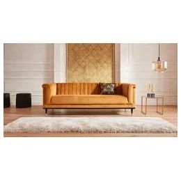 Guido Maria Kretschmer Home & Living 3-Sitzer GUIDO MARIA KRETSCHMER HOME & LIVING "Chamby" Sofas Gr. B/H/T: 210 cm x 71 cm x 85 cm, Samtoptik, goldfarben mit Holzrahmen unten und Steppung im Lehnenbereich