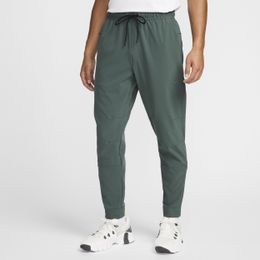 Nike Unlimited vielseitige Dri-FIT Hose mit Reißverschluss am Bündchen für Herren - Grün